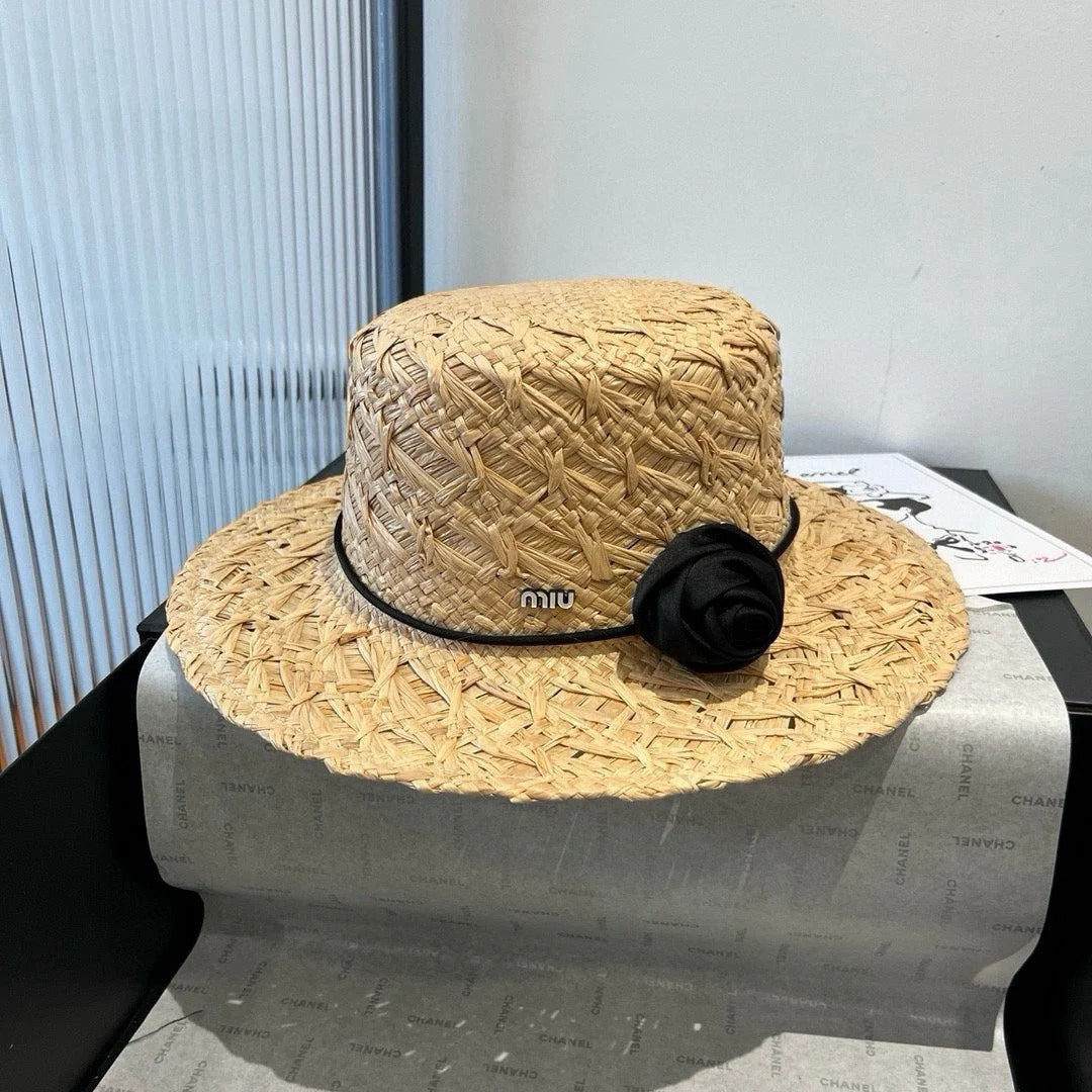 MM STRAW HAT IN BEIGE RAFFIA WITH BLACK FLOWER ACCENT – Amejews